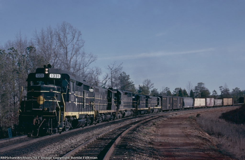 SCL GP30 #1331 leading SCL GP9 #1034, SCL SD45-2 #2051, SCL GP7 #771 and SCL U36B #1773 on SCL ...